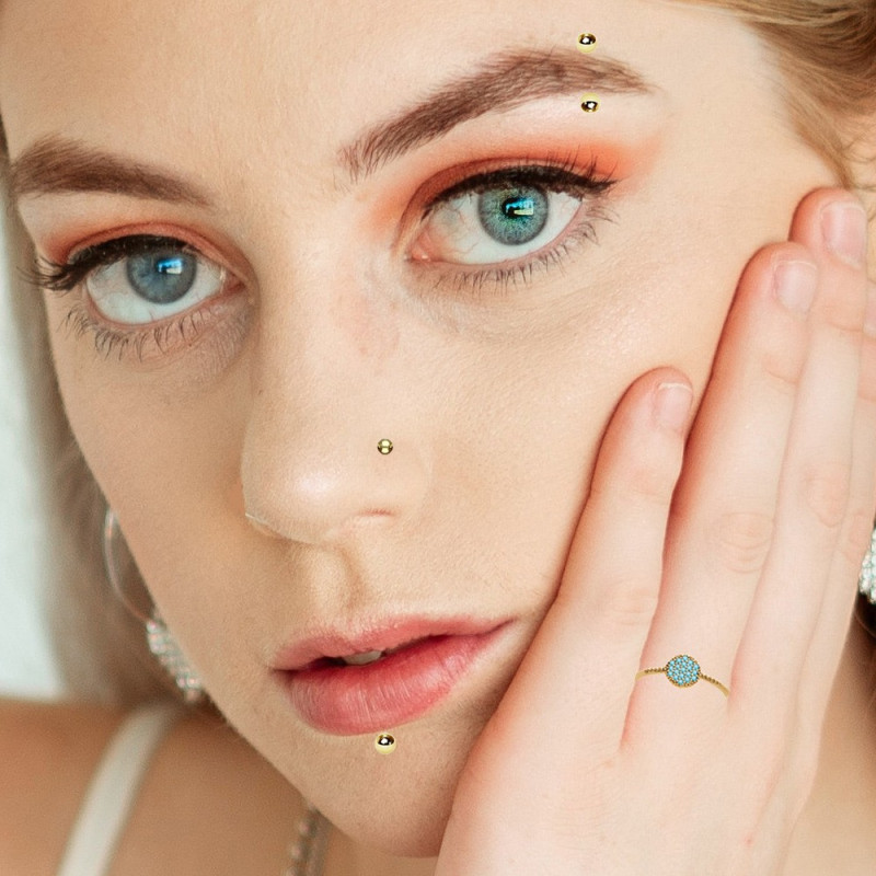 Piercing banane 1,2 mm en titane anodisé doré pour arcade